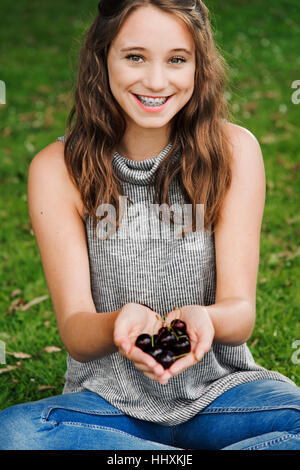 Girl Handful Cherry Smiling Happiness Outdoors Concept Stock Photo - Alamy