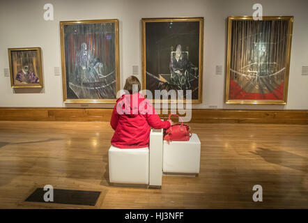 A member of the public views works from Francis Bacon's Screaming Popes ...