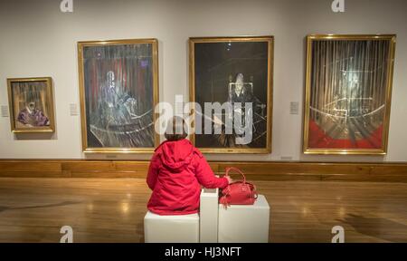 A member of the public views works from Francis Bacon's Screaming Popes ...