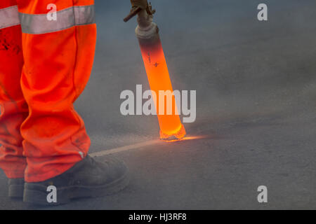 Thermal lance, burning off, road markings UK, thermoplastic material ...