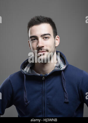 handsome bearded man or serious hooded guy with beard sunny outdoor on ...