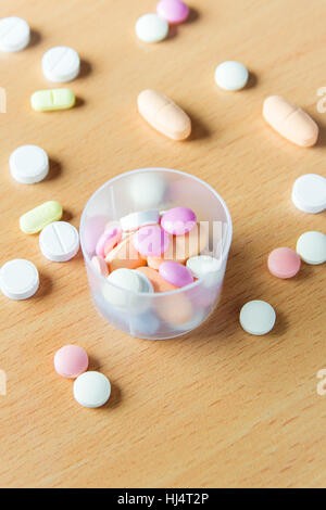 birth control pills on wooden background, close up Stock Photo - Alamy