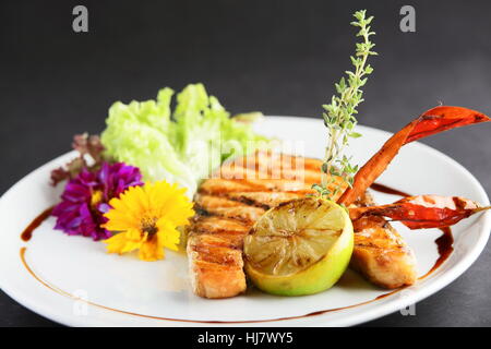 hot and tasty big peace of roasted fish Stock Photo - Alamy