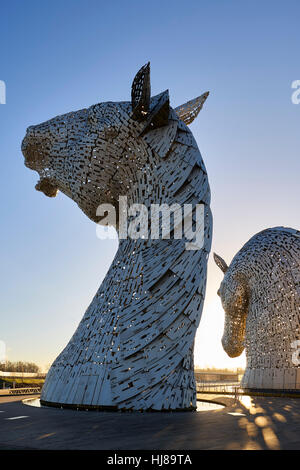 The Kelpies, two large horse-head sculptures, are beautifully reflected ...
