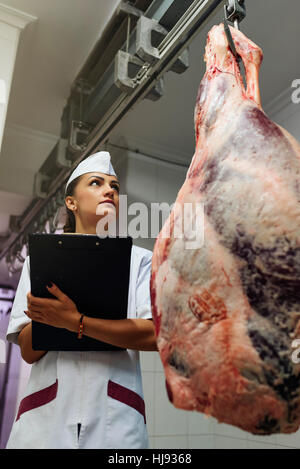 Meat quality control in butchery Stock Photo - Alamy