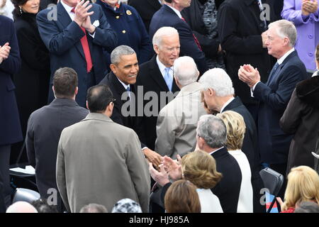 Former President Barack Obama greets the first group of visitors at the ...