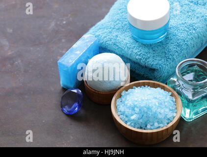 Spa concept turquoise - soap, salt, cream, towel Stock Photo - Alamy