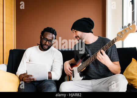 Artists producing music in their home sound studio Stock Photo - Alamy