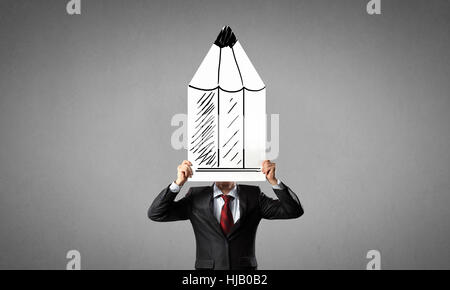 Businessman hiding his face behind pencil paper sheet Stock Photo - Alamy