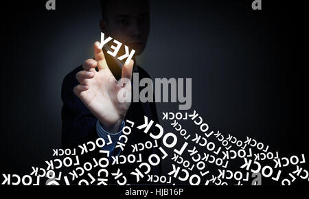 Male hand taking key glowing sign with fingers Stock Photo - Alamy
