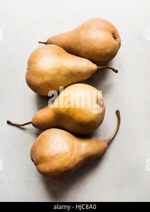 Four fresh pears in a row isolated over white background Stock Photo ...