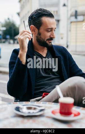 Caucasian man with beard wearing casual yellow t shirt showing and ...