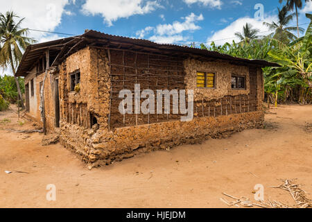 A poor village hut made of wood and clay. The traditional African home ...
