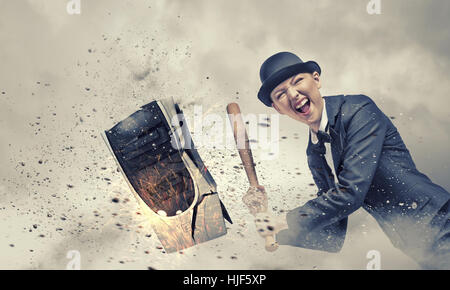 Young crazy woman damaging computer keyboards with baseball bat Stock ...