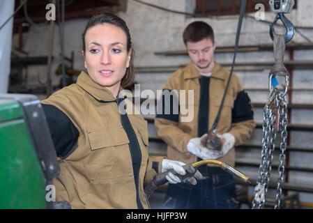 employees using industrial machinery at factory Stock Photo - Alamy