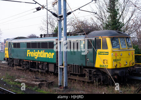 2 Freightliner class 86 electric locomotives making a silhouette at sun ...