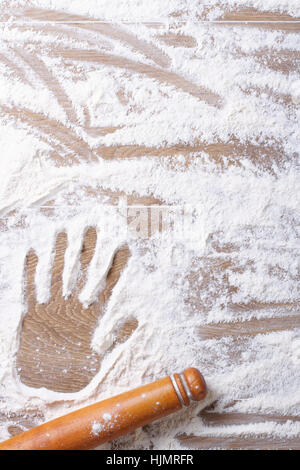 Imprint on female palm flour and rolling pin horizontal close-up Stock ...