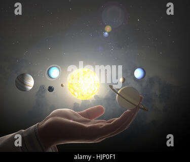Close up of planet sun system in your hand Stock Photo - Alamy