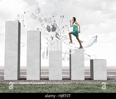Young businesswoman stepping up on chart bar Stock Photo - Alamy