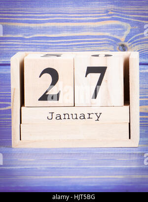 January 27th. January 27 wooden cube calendar with blur objects on ...