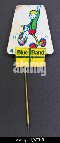 Advertising pin for Blue Band, featuring the 'bokkensprong' design, a ...
