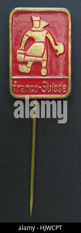 A Franco-Suisse advertising pin from the early 20th century ...