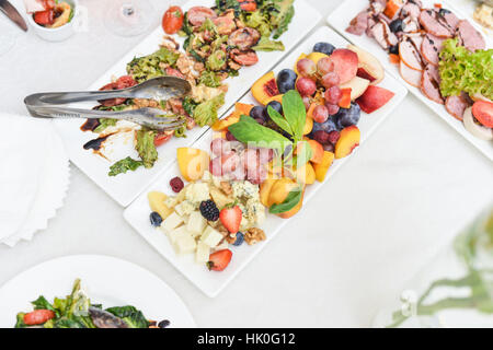 buffet table, Canape, sandwiches, snacks holiday table sliced glasses ...