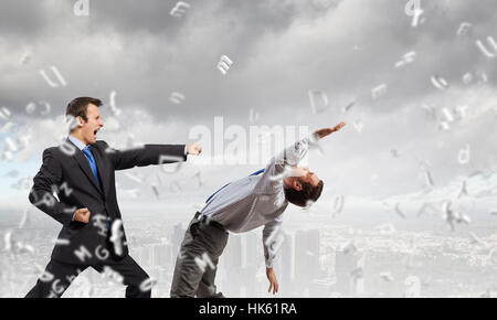 Two businesspeople in anger fighting with each other Stock Photo - Alamy