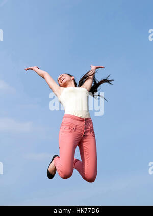 woman makes freudensprung Stock Photo - Alamy