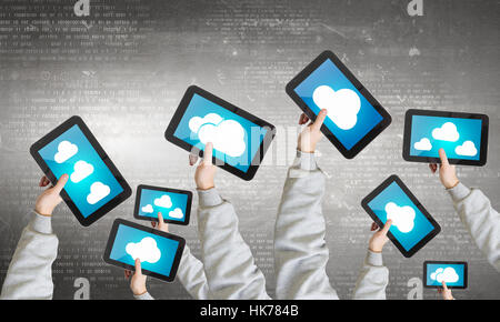 Team of business people holding tablets in hands Stock Photo - Alamy
