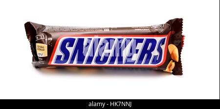 Snickers chocolate bar on white background with open cut up bar by the ...