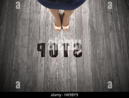Top view of businesswoman feet and stop sign Stock Photo - Alamy