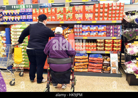 A disabled man shops at Aldi in his wheelchair Stock Photo - Alamy