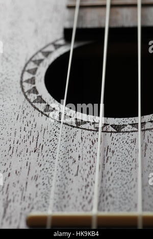 Ukulele. Strings and sound hole, close up Stock Photo - Alamy