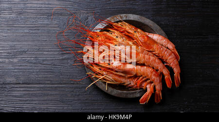 Top view of black plate on wooden background. Empty space for your ...