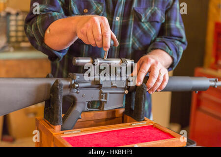 Fitting lapping bar into scope rings Stock Photo - Alamy