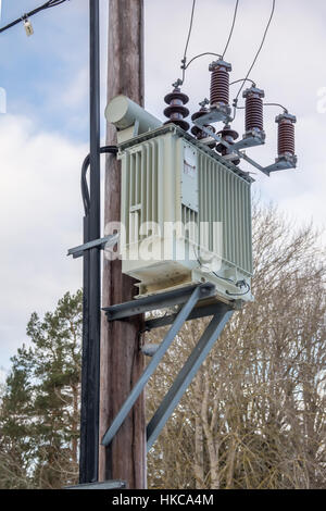 Three phase pole mounted high voltage mains transformer frozen with ...