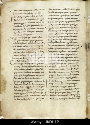 An ancient manuscript featuring intricate script and a central ...