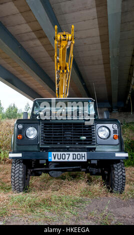 Land Rover vehicle with cherry picker crane mounted on its back rented ...