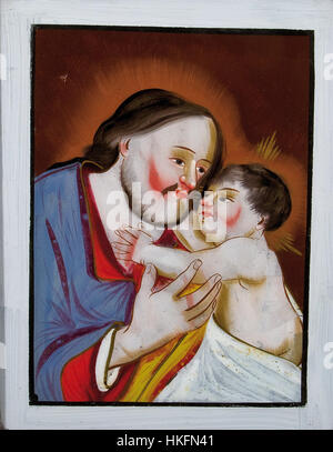 Religious painting of Saint Joseph holding the infant Jesus, created by ...