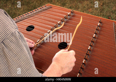 Playing the dulcimer folk musical instrument from Europe Stock Photo ...
