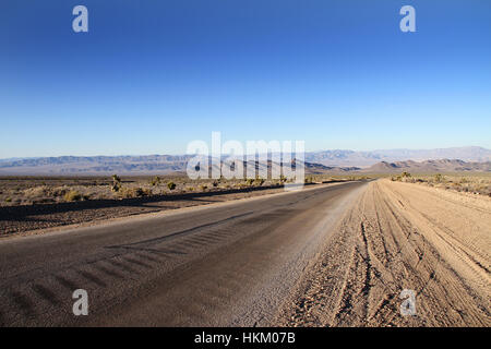 abandoned highway in desert landscape - long straight road - vintage ...