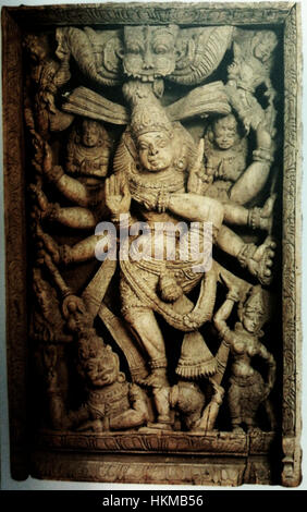 This sculpture depicts Shiva in the Dance of Bliss, with Vishnu and ...