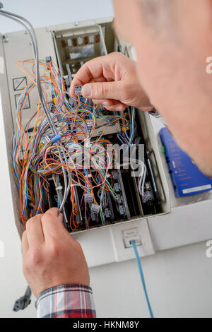 Untidy office cables and wires Stock Photo - Alamy