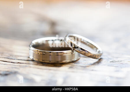 Wedding rings on a wooden surface with copy space Stock Photo - Alamy