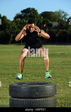 young athlete has workout and jumps on skipping rope outdoor Stock ...