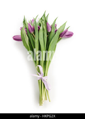 From above bouquet of fresh violet flowers placed on marble table near ...