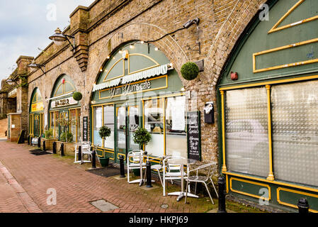 Shops and Cafes occupying space under railway arches, Mill Row, Bexley ...