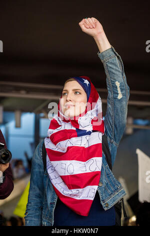 woman with raised fist protesting on demonstration Stock Photo - Alamy