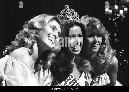 Debbie Greenwood, 24, (centre) winner of Miss Great Britain 1984, is ...